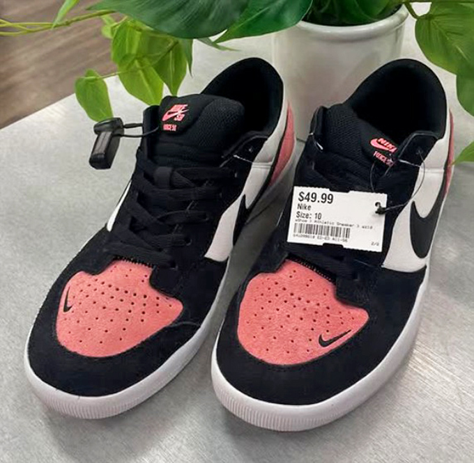These Nike kicks prove that fashion-forward footwear doesn't require a second mortgage. Black, white, and coral combine for street-ready style.