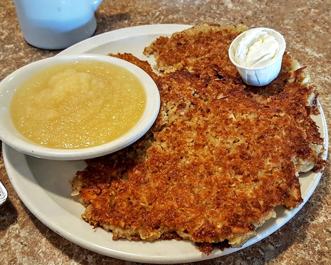 These aren't just pancakes; they're golden-brown crispy-edged masterpieces. Applesauce on the side is the unexpected sidekick every hero needs.