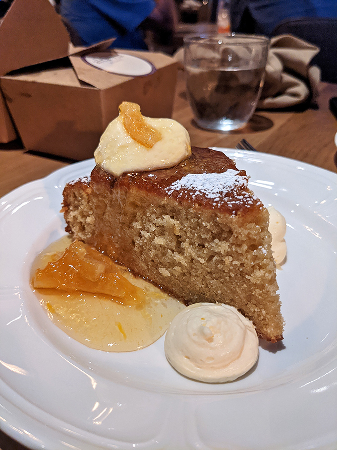 This olive oil cake isn't just dessert, it's therapy—moist, delicate crumb with citrus notes and dollops of cream that make time stand still.