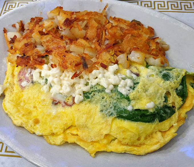 This isn't just an omelet&mdash;it's a golden envelope of eggs delivering a love letter of spinach, cheese, and perfectly crisped hash browns.