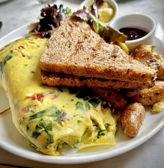 Whoever said "you can't improve on the classics" never met this omelet—a fluffy golden pillow stuffed with savory treasures.
