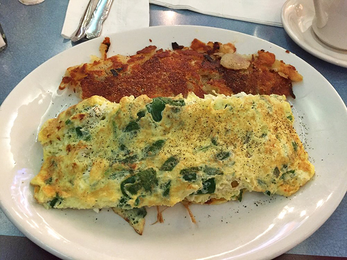An omelet shouldn't just be breakfast&mdash;it should be architecture. This green pepper masterpiece comes with a side of crispy potato perfection.