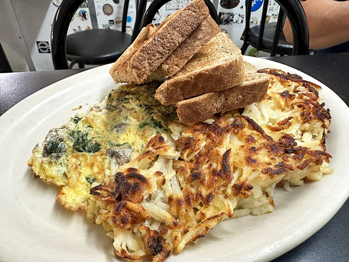 The Hippie Hash isn't just breakfast, it's a cultural institution&mdash;crispy potatoes supporting a colorful democracy of vegetables and cheese with toast standing by for support.