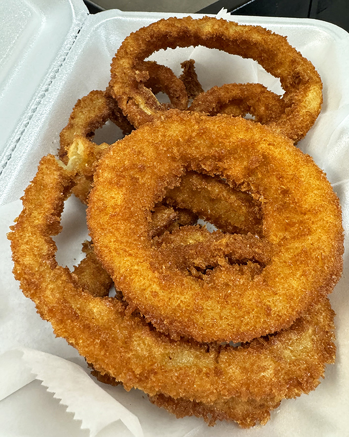 Golden halos of crispy perfection. These onion rings deserve their own theme music every time they arrive at the table.