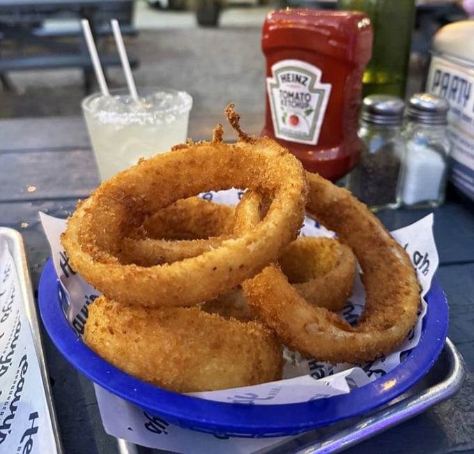These onion rings aren't playing games &ndash; golden-brown halos of crunch that make ketchup feel like it won the condiment lottery.