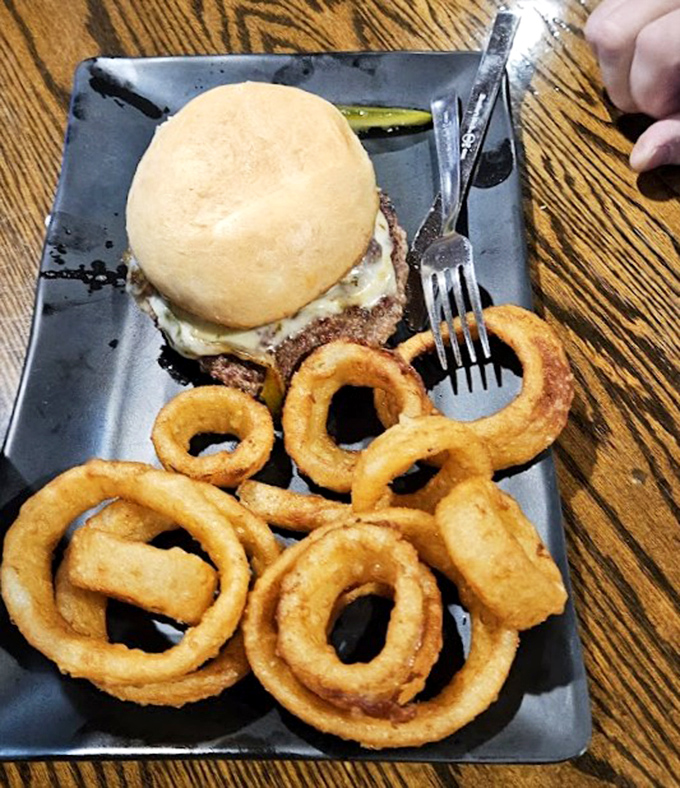 The humble onion ring, elevated to art form. Crispy, golden circles of joy that make the perfect sidekick to any burger adventure.