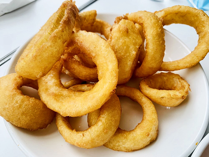 Onion rings so perfectly golden and crisp, they make that sad bag of chips in your pantry contemplate an early retirement.