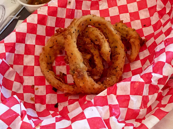 Onion rings that shatter with each bite &ndash; perfectly seasoned circles of joy that make you wonder why vegetables ever bothered being healthy.