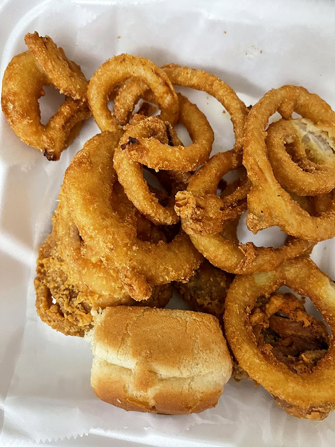 Onion rings that snap with that perfect crunch &ndash; the kind that make conversation stop mid-sentence while everyone at the table reaches for more.