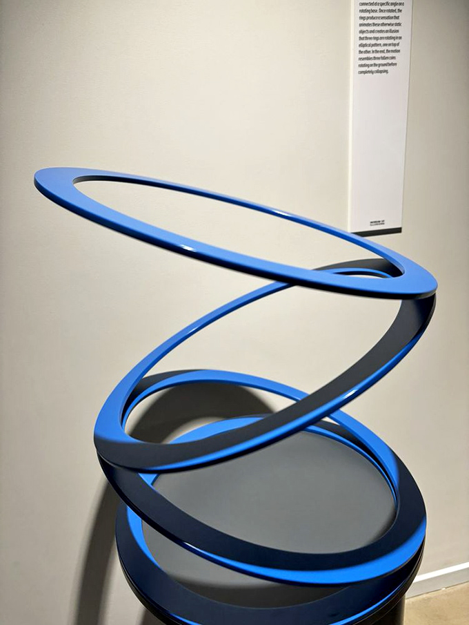 This blue spiral sculpture isn't just art&mdash;it's a mathematical mind-bender that makes you question whether Escher moonlighted as an interior decorator.