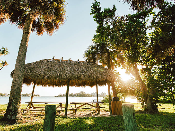 Tiki hut nirvana: Where picnic tables become five-star dining when paired with that million-dollar bay view and sunset ambiance.