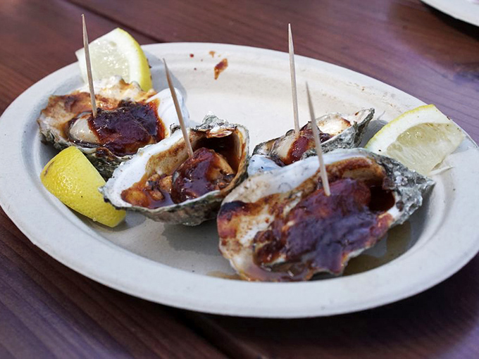 BBQ oysters with lemon wedges &ndash; because sometimes the ocean and the smoker need to have a conversation. A delicious, unexpected dialogue.