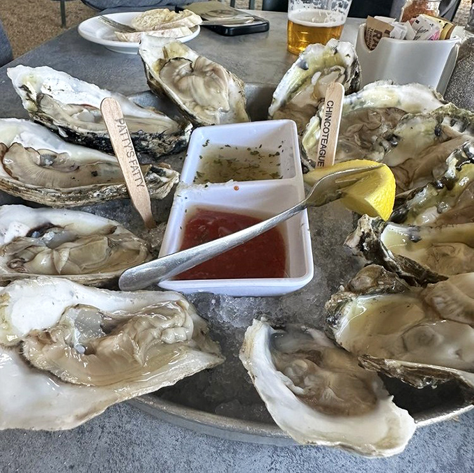 These plump oysters on the half shell aren't just seafood – they're little cups of ocean perfection, waiting for a squeeze of lemon and a moment of reverence.