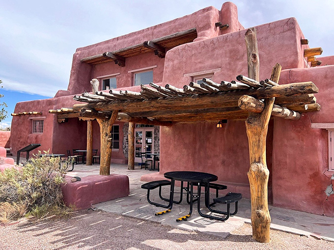 The Painted Desert Inn stands like a terra-cotta dream. This historic adobe structure offers shade, stories, and spectacular views that no hotel chain could match. 
