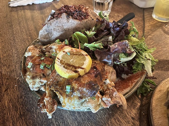 Even the chicken gets the royal oak-grilled treatment, emerging tender and smoky from this frontier kitchen.