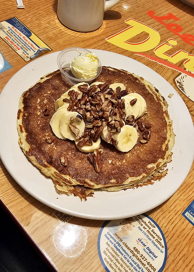 This pancake, topped with bananas and pecans, isn't trying to win Instagram&mdash;it's trying to win your heart, one fluffy bite at a time.