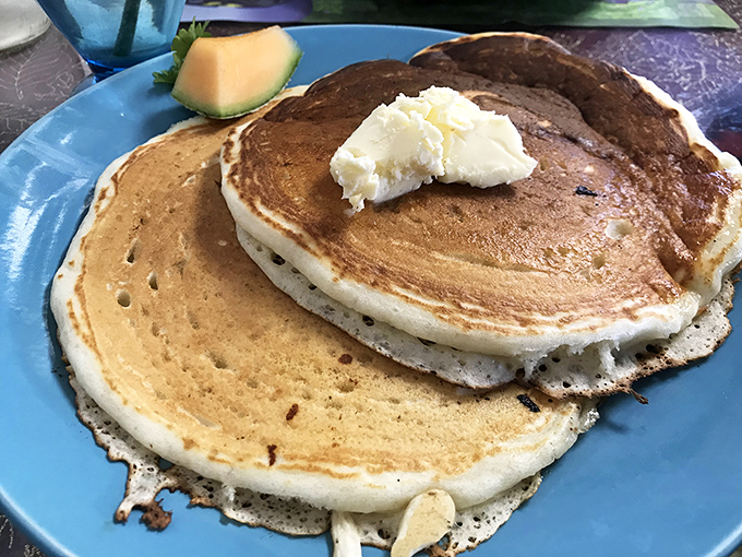 Golden pancakes so fluffy they practically float off the plate like edible clouds of happiness.