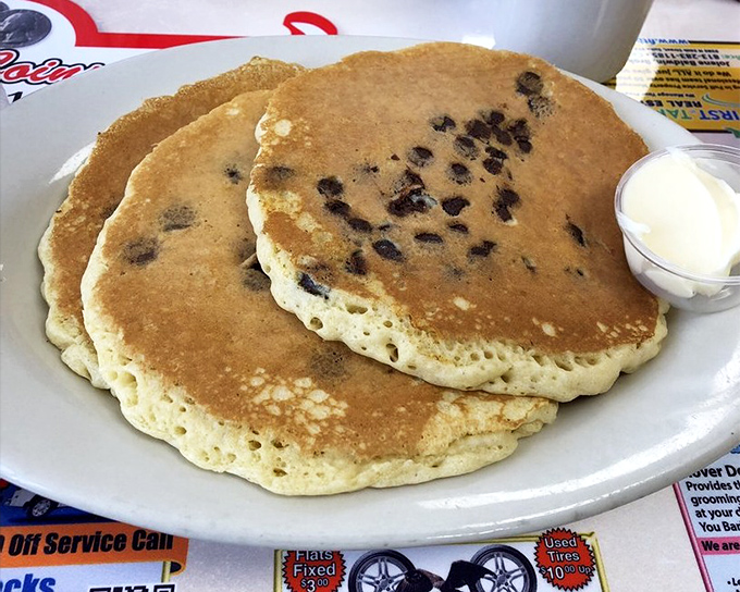 Pancakes so fluffy they practically hover above the plate, studded with chocolate chips that melt into pockets of sweet perfection.
