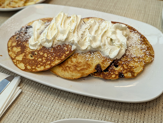 These pancakes don't need to post gym selfies to prove their fluffiness &ndash; they're confidently topped with whipped cream and ready for their close-up.
