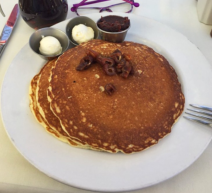 Pancakes so perfectly golden they could win medals, topped with dates that remind you why you're in the date capital of America.