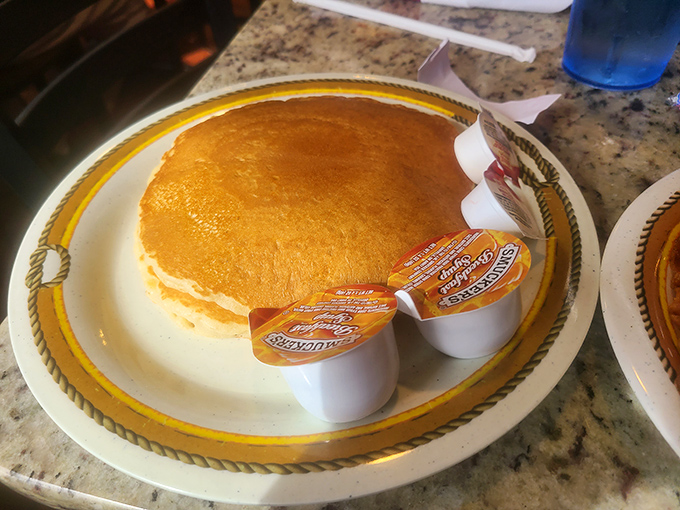 The pancake that ate Manhattan! Golden, fluffy, and approximately the size of a small frisbee &ndash; breakfast engineering at its finest.