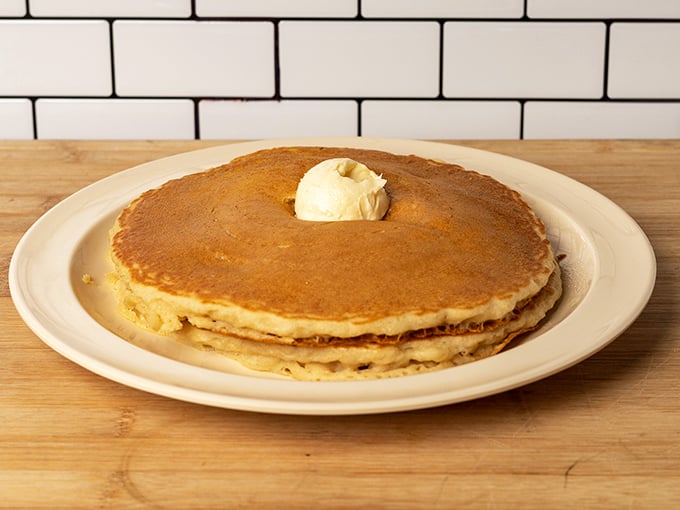 The pancake that launched a thousand diets – and ended them just as quickly. That melting butter pat is practically winking at you.