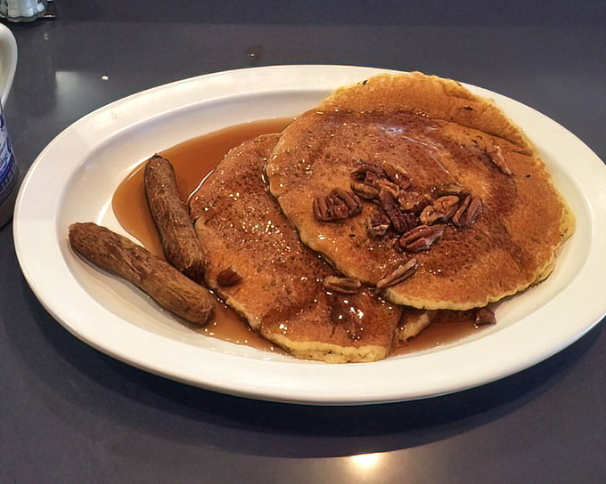Pecan pancakes that make you question every other breakfast decision you've ever made. That maple syrup river should have its own zip code.