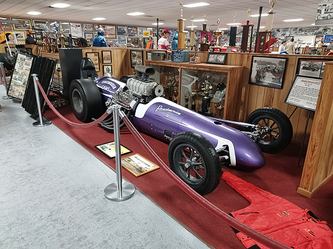 Swamp Rat 33 sits in silent testimony to innovation. The sleek black missile looks like it could break land speed records even while parked.