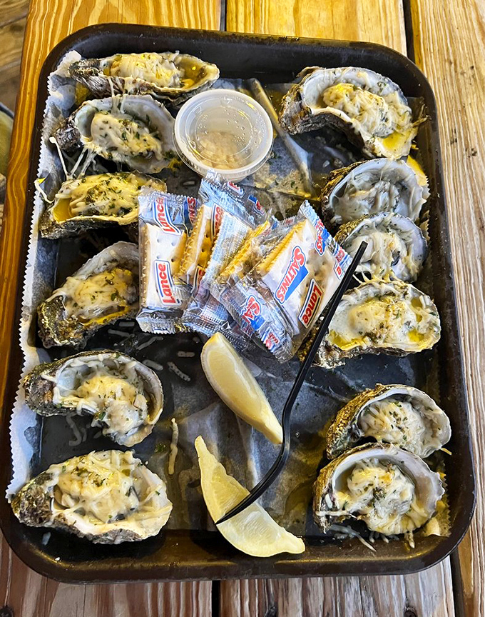 Oysters wearing parmesan like a fancy coat, lined up and ready for their grand entrance into the happiest dinner party&mdash;your mouth.