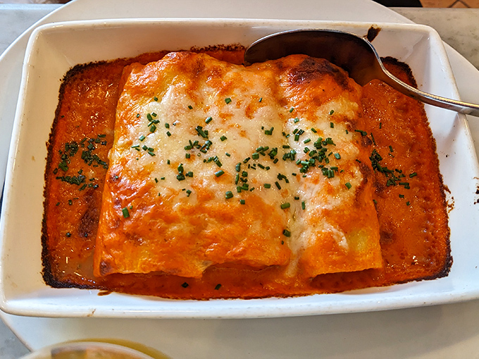 Lasagna that doesn't know the meaning of restraint. That golden cheese top is the sunroof to a vehicle stacked with pasta and overflowing with flavor.