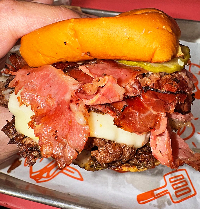 The Pastrami Burger doesn't just blur the line between sandwich categories&mdash;it obliterates it in the most delicious identity crisis ever.