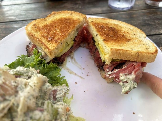 A pastrami sandwich that doesn't mess around&mdash;pink, peppery meat stacked generously between toasted bread with just enough greens for plausible deniability.