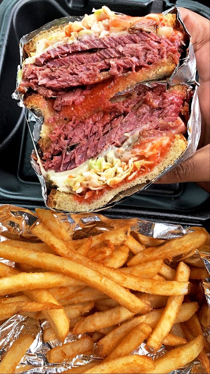 This sandwich isn't just lunch&mdash;it's an architectural marvel of smoked meat, coleslaw, and sauce that requires both hands and absolutely no dignity to consume properly.