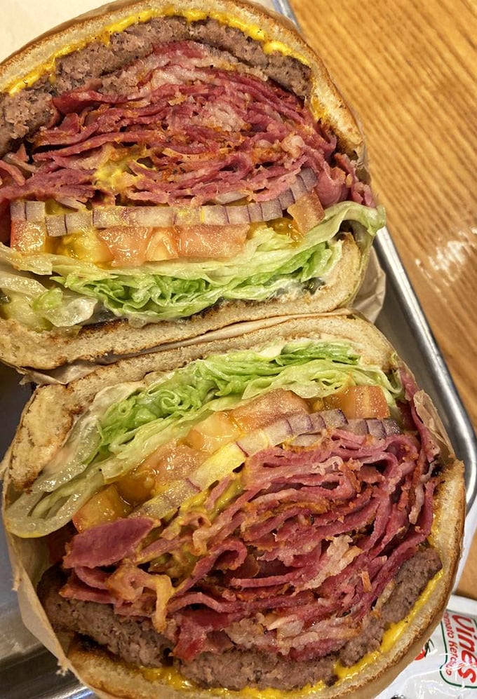 That pastrami burger looks like it could solve world peace, one magnificent bite at a time.