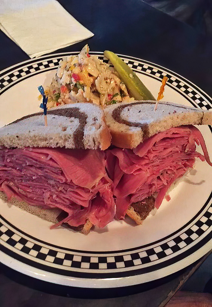 Pastrami piled higher than Manhattan rent prices, with just enough rye bread to technically call it a sandwich.