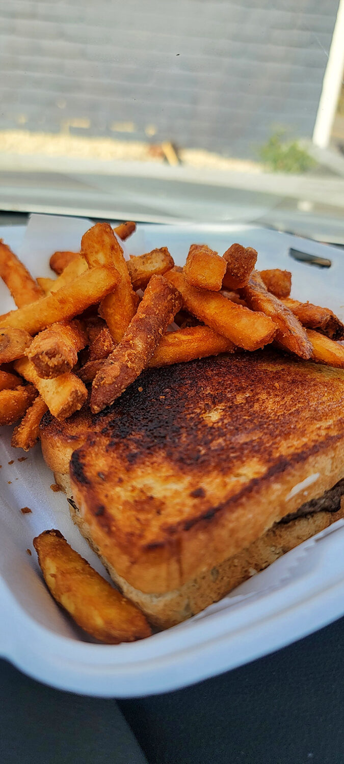 Golden-brown perfection meets crispy satisfaction. Those onion rings aren't just sides; they're the supporting actors who steal the show.