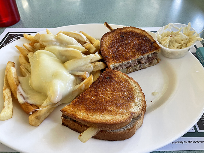 A patty melt that understands the assignment. Perfectly grilled bread, melty cheese, and that side of coleslaw playing the unsung hero of the plate.