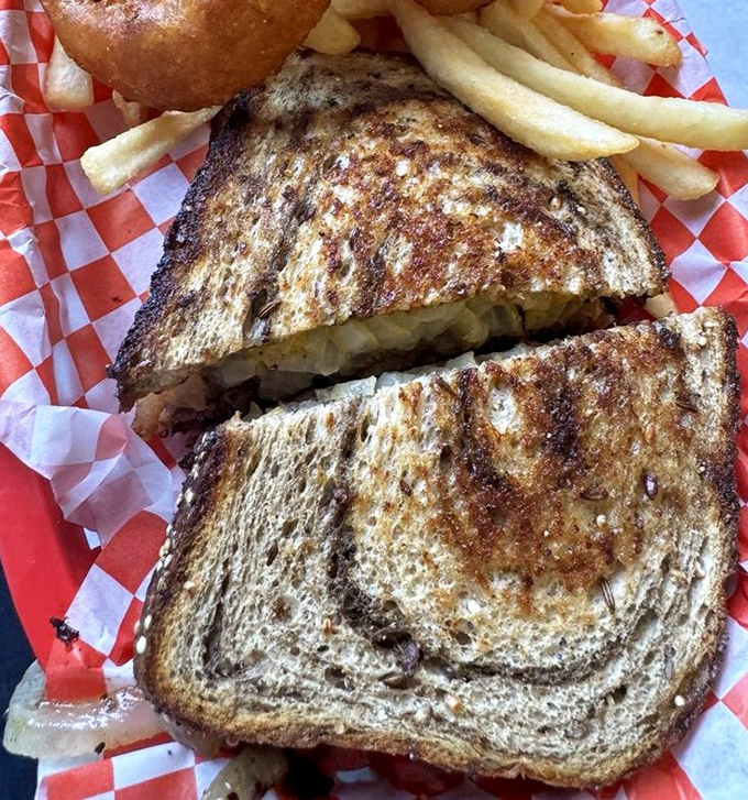The patty melt &ndash; that perfect marriage of grilled bread and melted cheese. Served on classic red-checkered paper that practically screams "authentic diner."