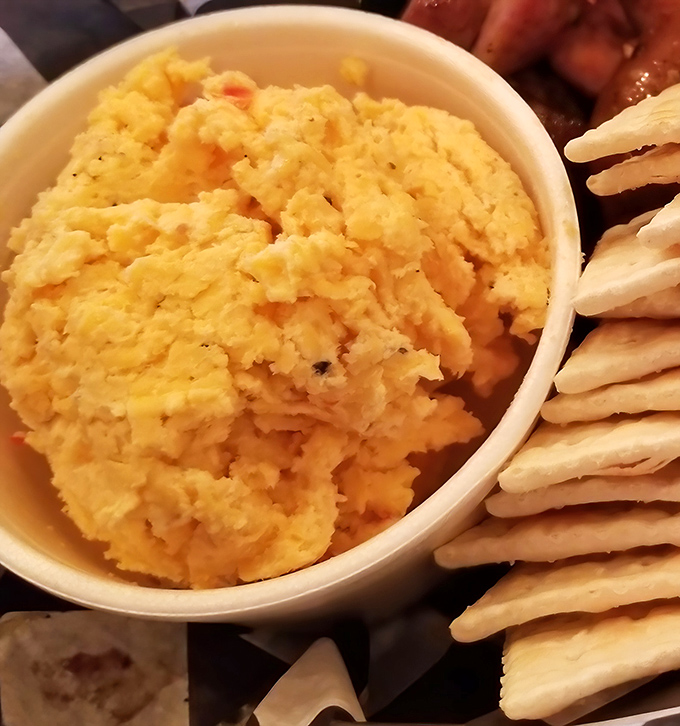 Cheese grits that would make a Southerner weep tears of joy, served alongside crackers that know their supporting role in this comfort food drama.