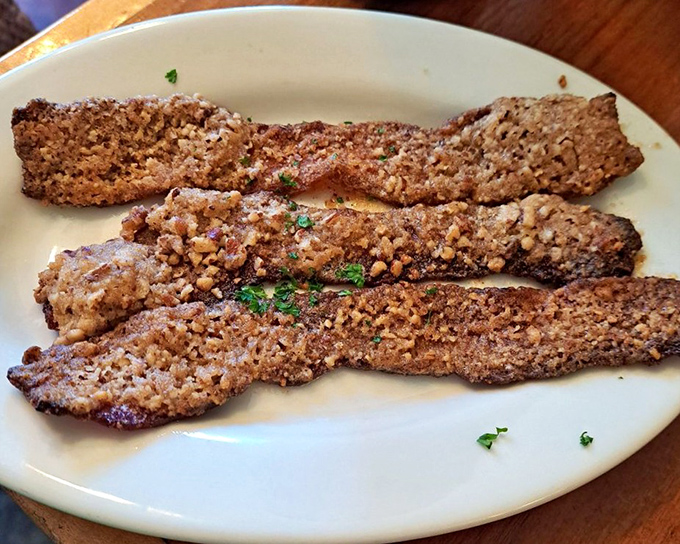 Pecan-crusted bacon that's both sweet and savory&mdash;proof that sometimes the side dish deserves to be the main event.