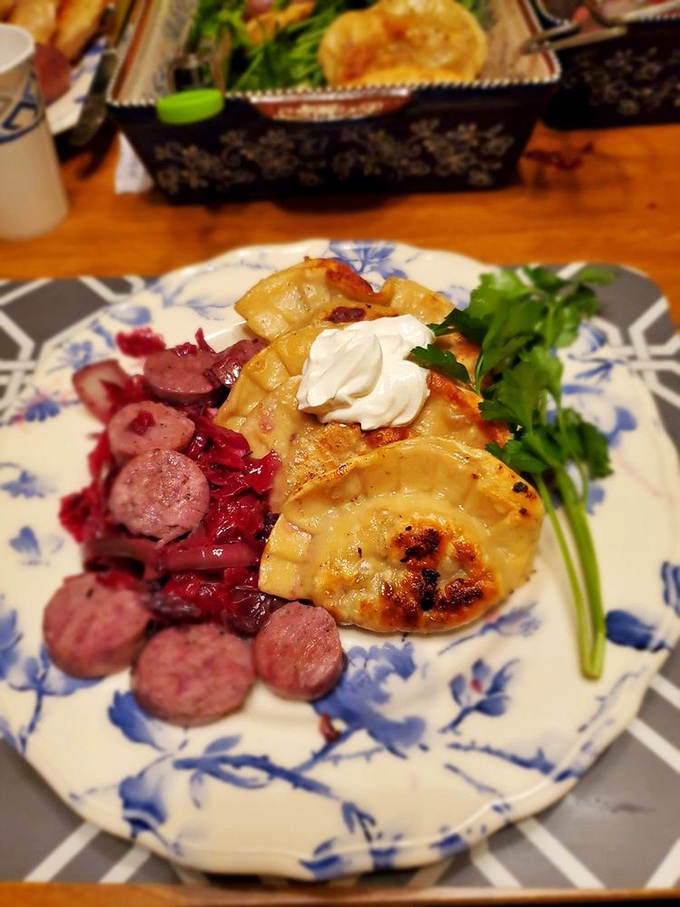 A Polish symphony on a plate: golden pierogies, ruby-red kielbasa, and bright greens creating the kind of harmony that makes taste buds applaud. 