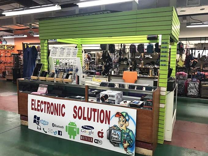 Need a tech fix? This "Electronic Solution" booth promises to resurrect your devices while you hunt for treasures elsewhere.