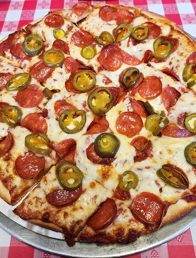 Pizza that doesn't need fancy wood-fired ovens or imported Italian flour—just the perfect balance of melty cheese, pepperoni, and those jalapeños that say "I'm not afraid to live dangerously."