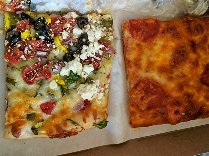 Pizza that looks like it graduated from culinary school with honors. That feta-topped masterpiece isn't just lunch—it's a Mediterranean vacation on dough.