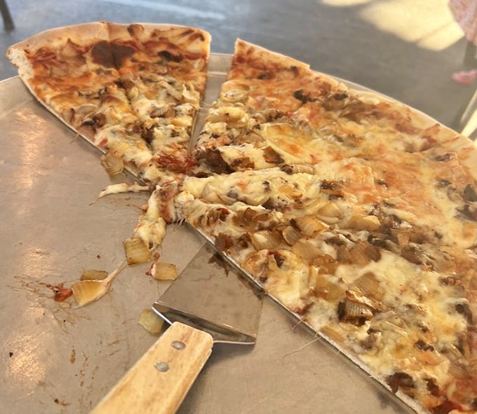 Cheesesteak pizza: Philadelphia's two greatest culinary achievements having a delicious love child right before your eyes. 