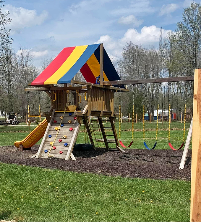 Kids burning off energy before showtime at the colorful playground. Smart parents know: tired children make for peaceful second features.