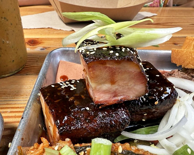 Glistening pork belly burnt ends that would make a vegetarian question their life choices. Caramelized, sticky, and utterly irresistible.