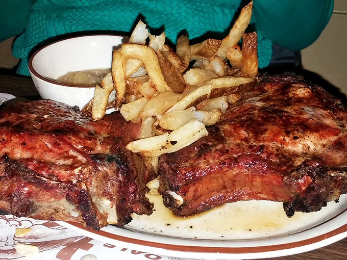 Ribs that look like they've been kissed by smoke and fire until they surrendered all their deliciousness. The fries aren't garnish&mdash;they're worthy sidekicks.