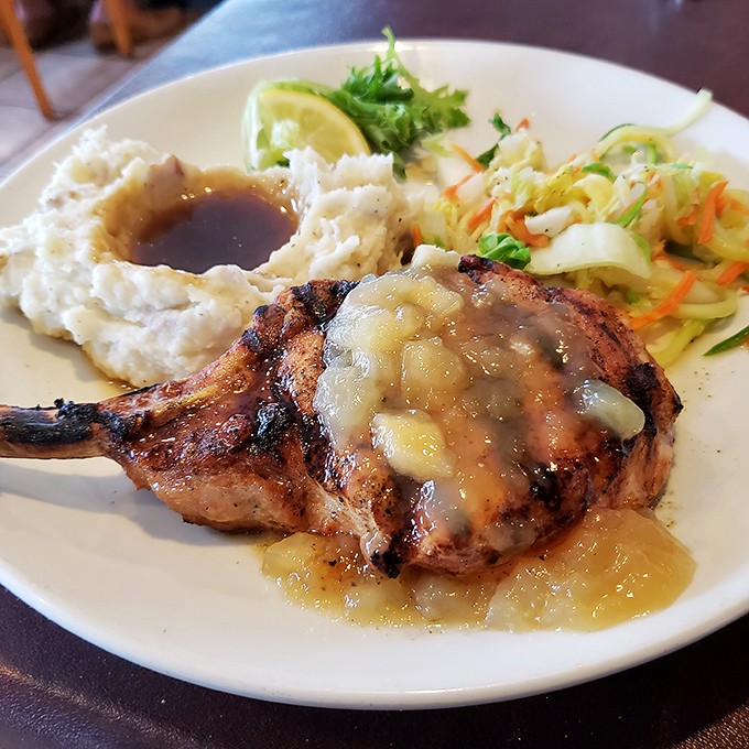 A pork chop that's been kissed by fire and blessed with apple chutney&mdash;comfort food that's dressed up but still knows where it came from.