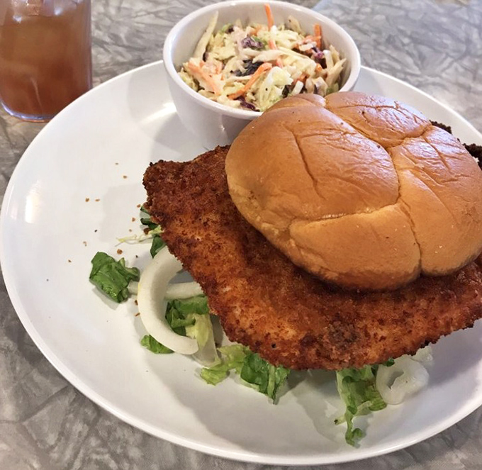 The pork tenderloin sandwich that answers the eternal question: "Why yes, the meat CAN be bigger than the bun!" Coleslaw provides moral support.